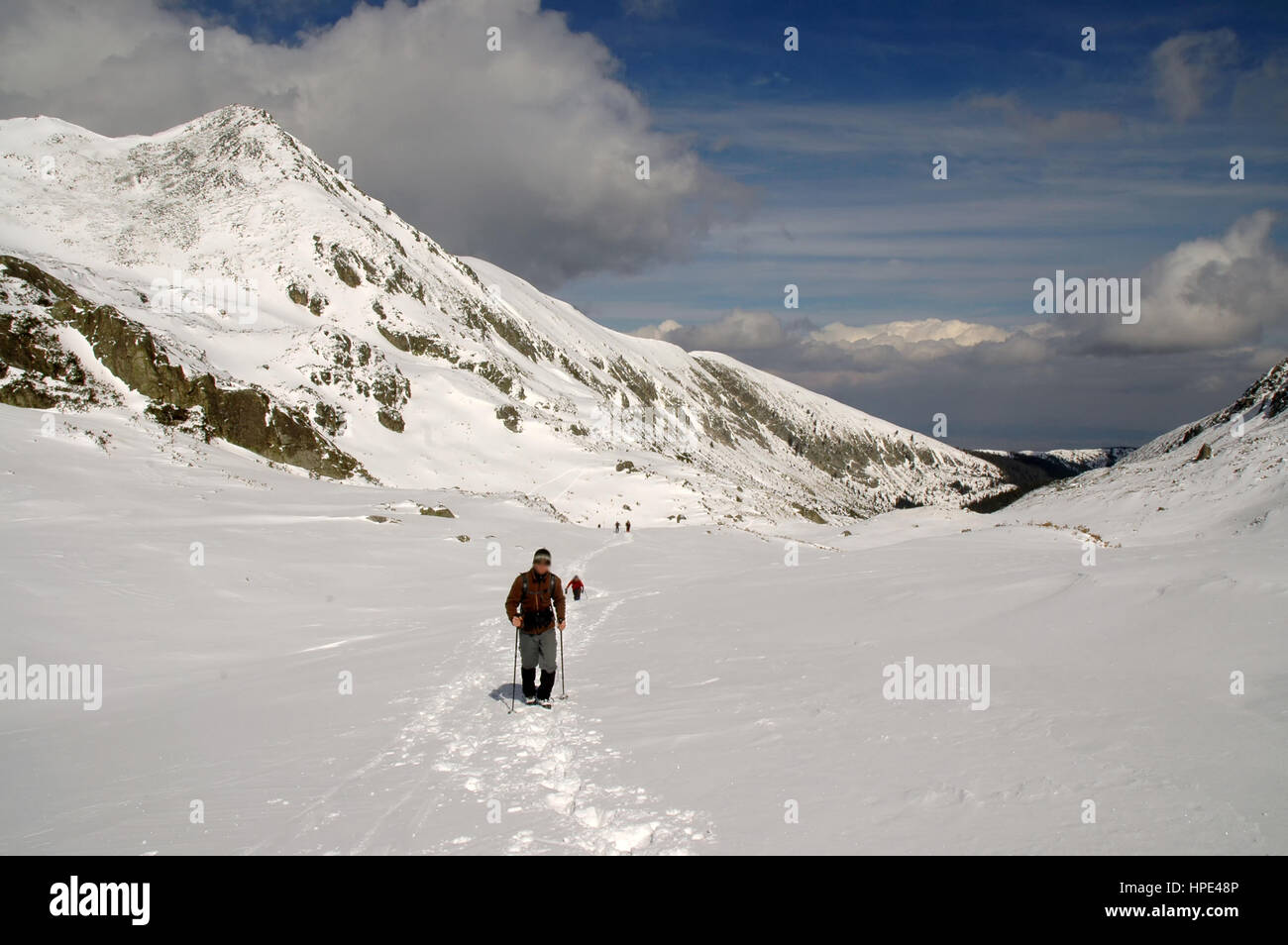 Group of people hiking in beautiful winter mountains Stock Photo - Alamy