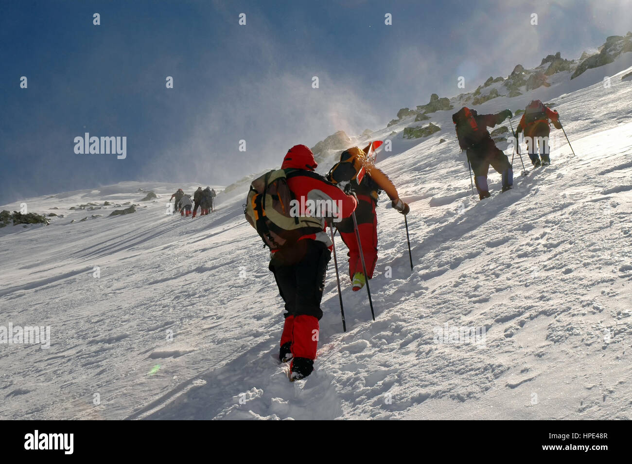 Group of people hiking in beautiful winter mountains Stock Photo - Alamy