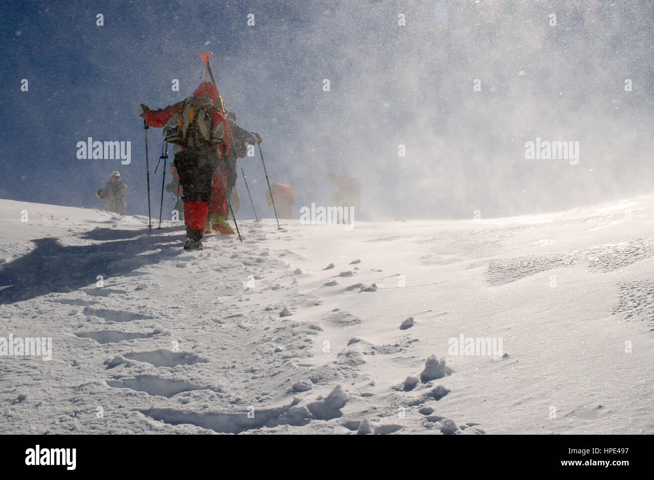 Group of people hiking in beautiful winter mountains Stock Photo - Alamy