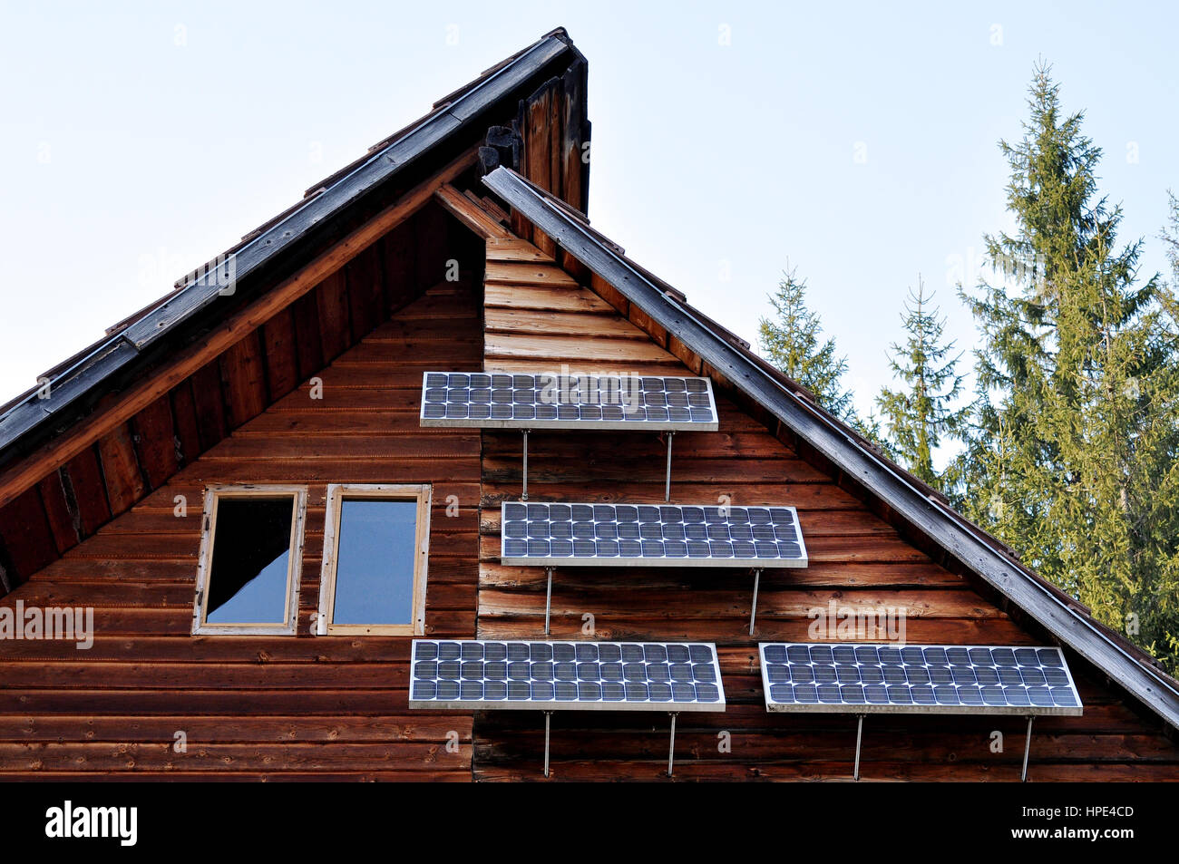 Solar panel on a wooden house Stock Photo - Alamy