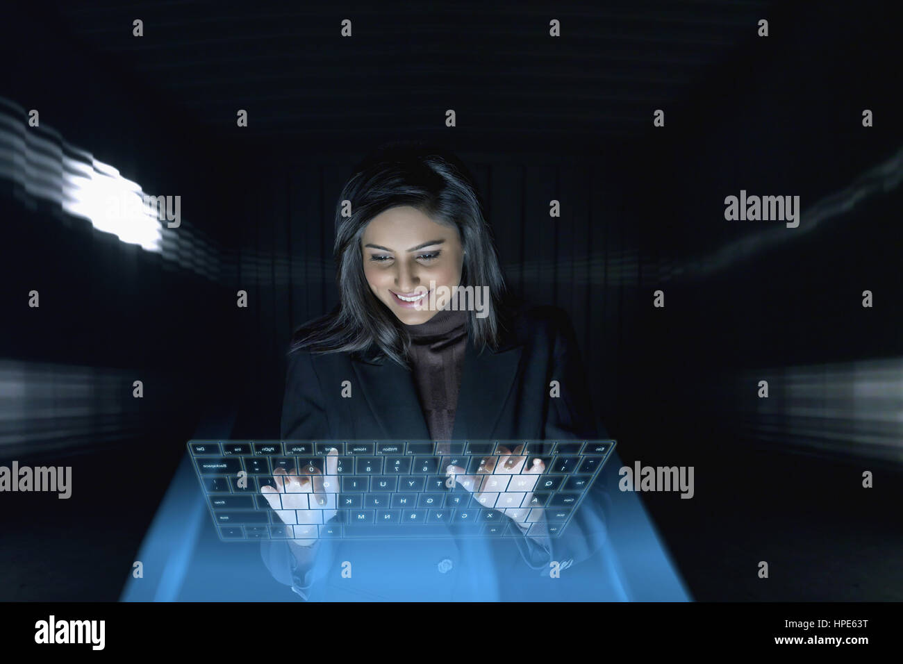 Smiling Businesswoman using virtual keyboard Stock Photo - Alamy