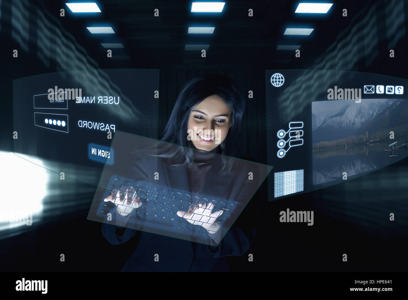 Smiling Businesswoman using virtual keyboard Stock Photo - Alamy
