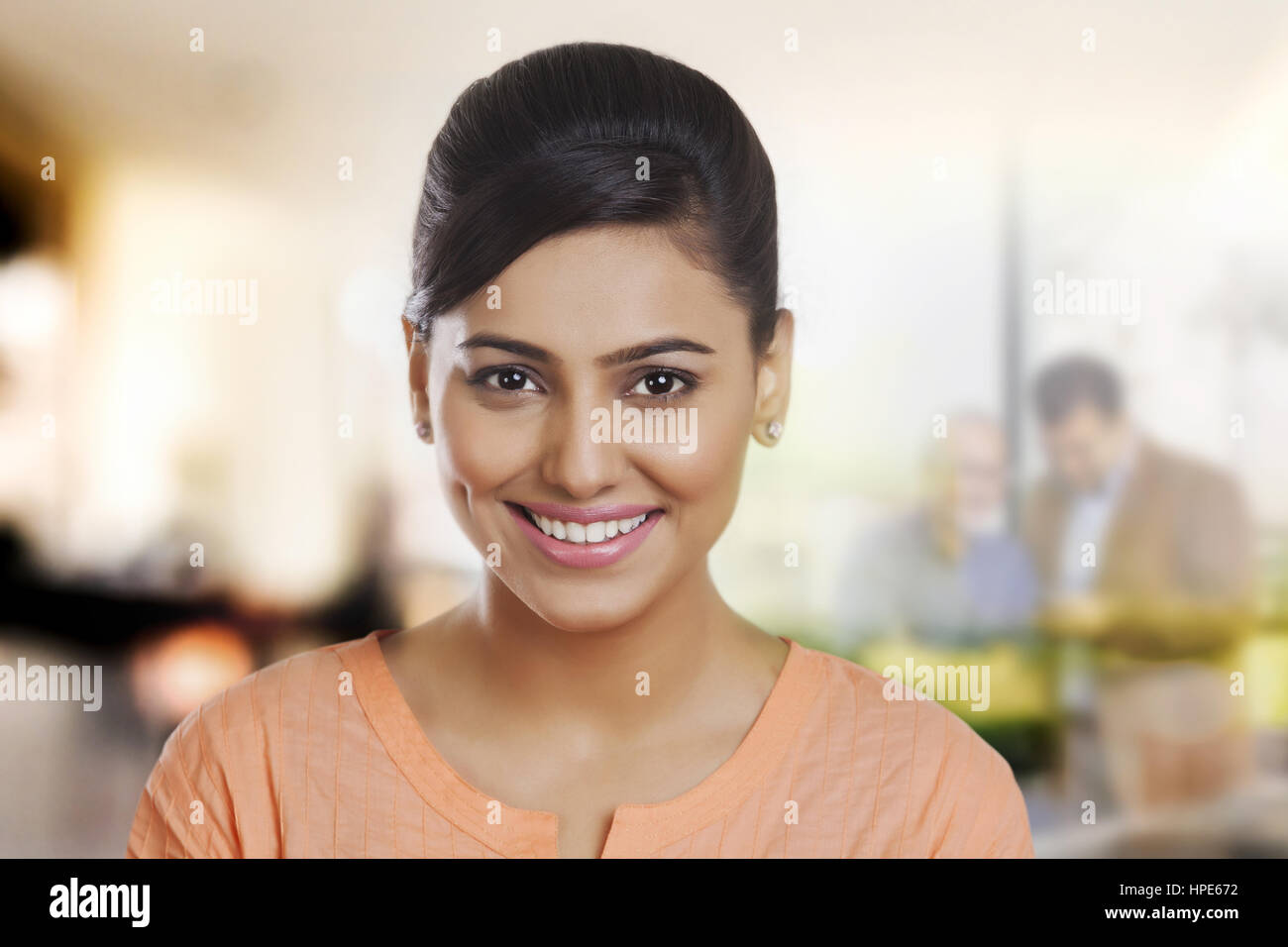 Woman looking camera in office hi-res stock photography and images - Alamy