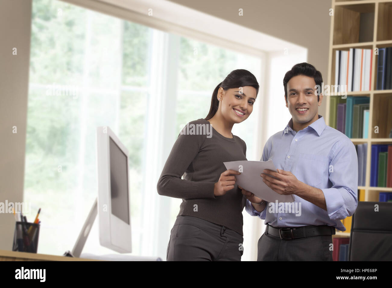 Two men looking at paperwork hi-res stock photography and images - Alamy