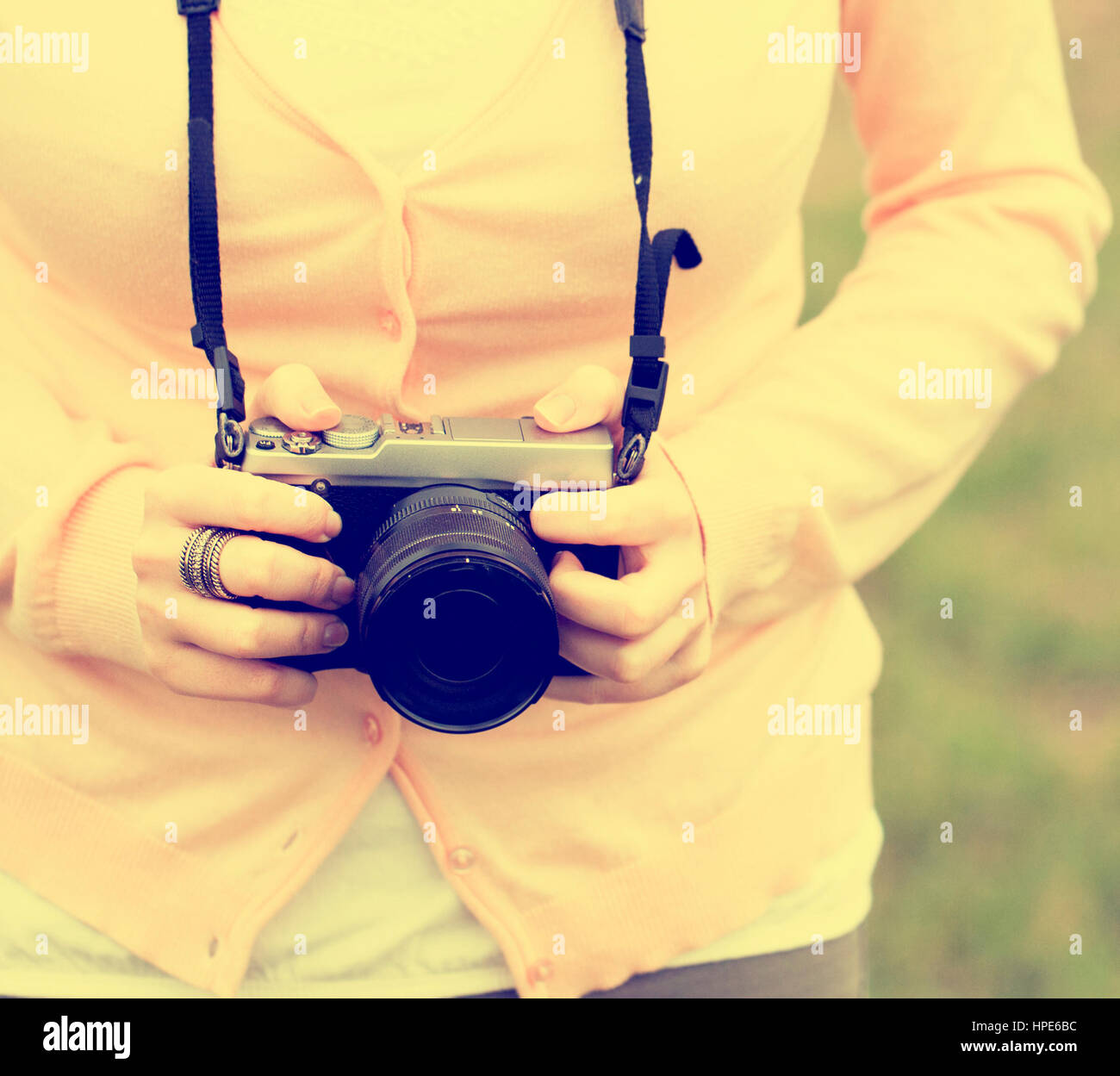 Woman with retro camera in sunset Stock Photo - Alamy