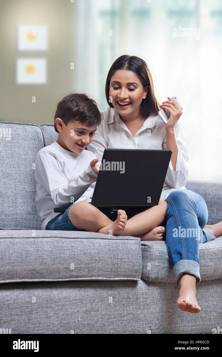 Mother typing hi-res stock photography and images - Alamy