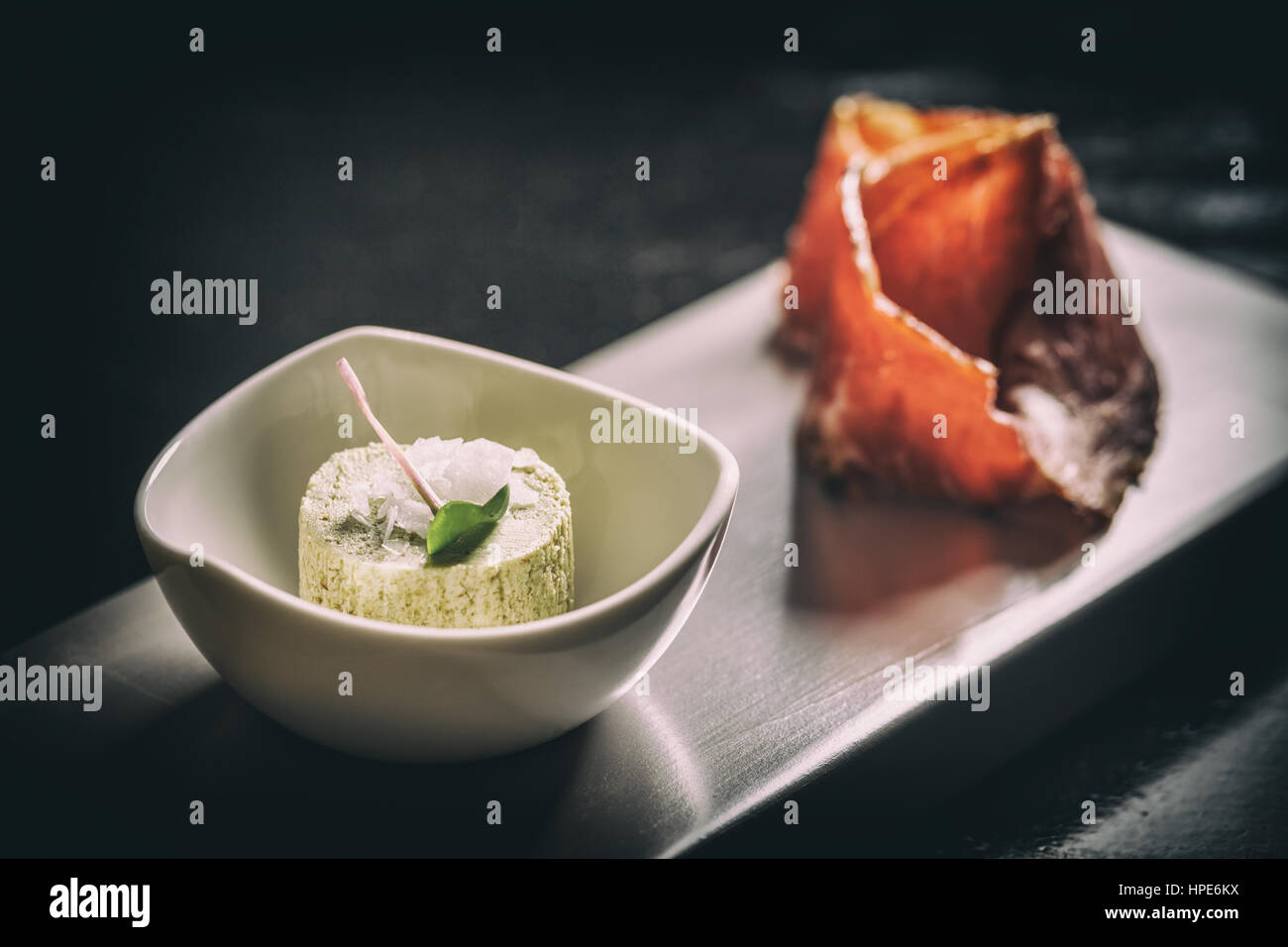 Appetizer plate in fine dining restaurant, compound butter with ...