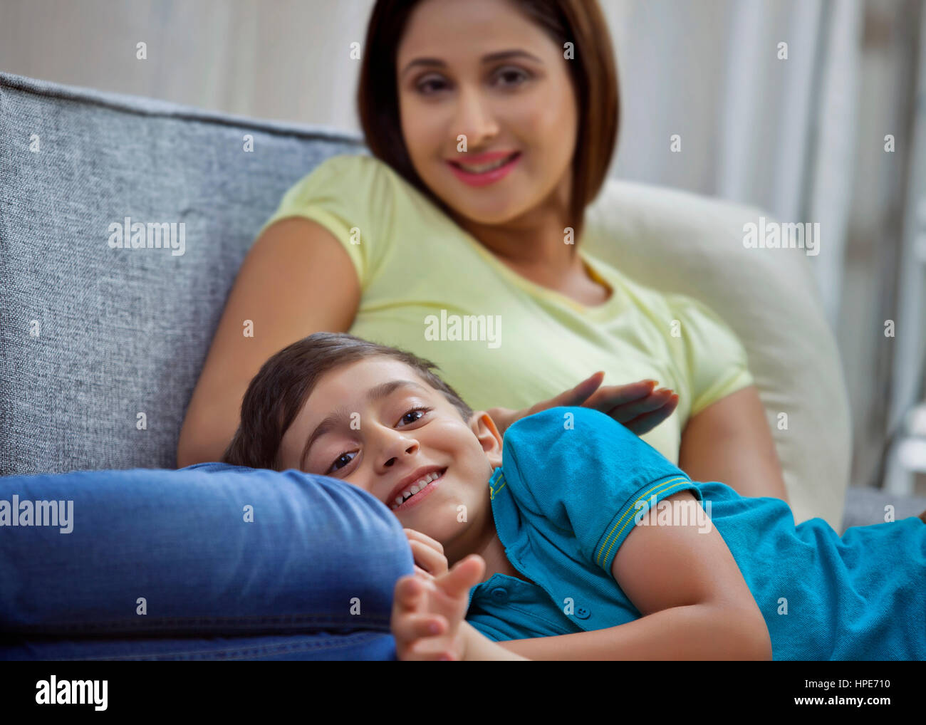Laying On Sofa Stock Photos & Laying On Sofa Stock Images - Alamy