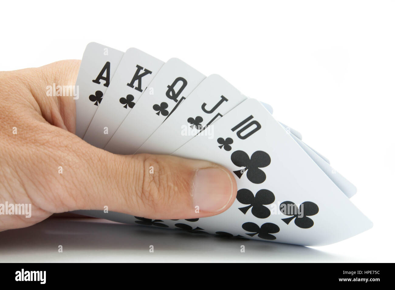 playing cards in hand isolated on white background Stock Photo - Alamy