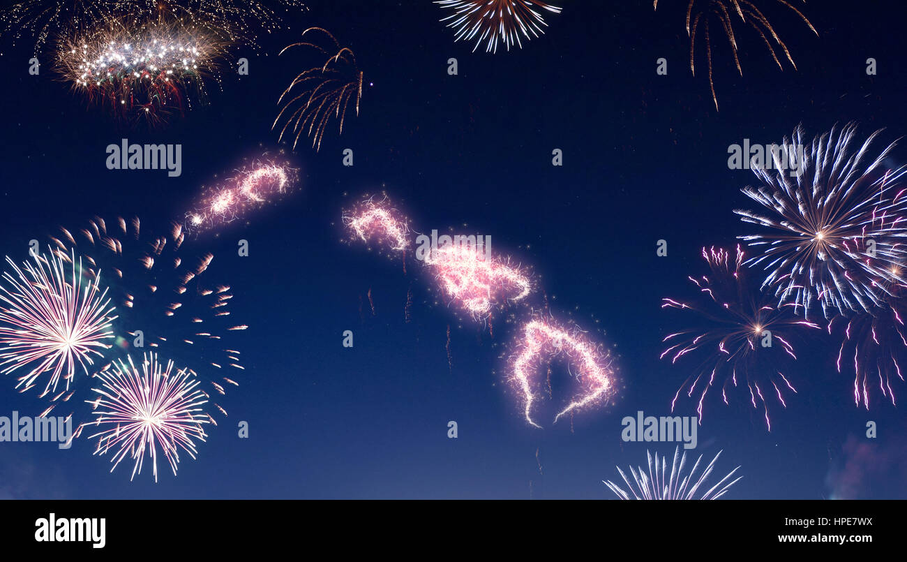A dark night sky with a sparkling red firecracker in the shape of ...