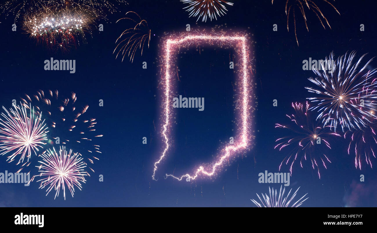 A dark night sky with a sparkling red firecracker in the shape of ...