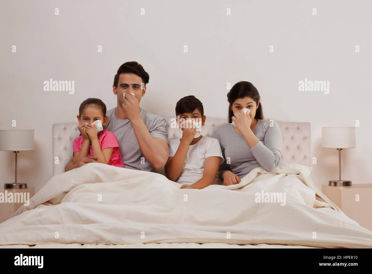 Family suffering from cold Stock Photo - Alamy
