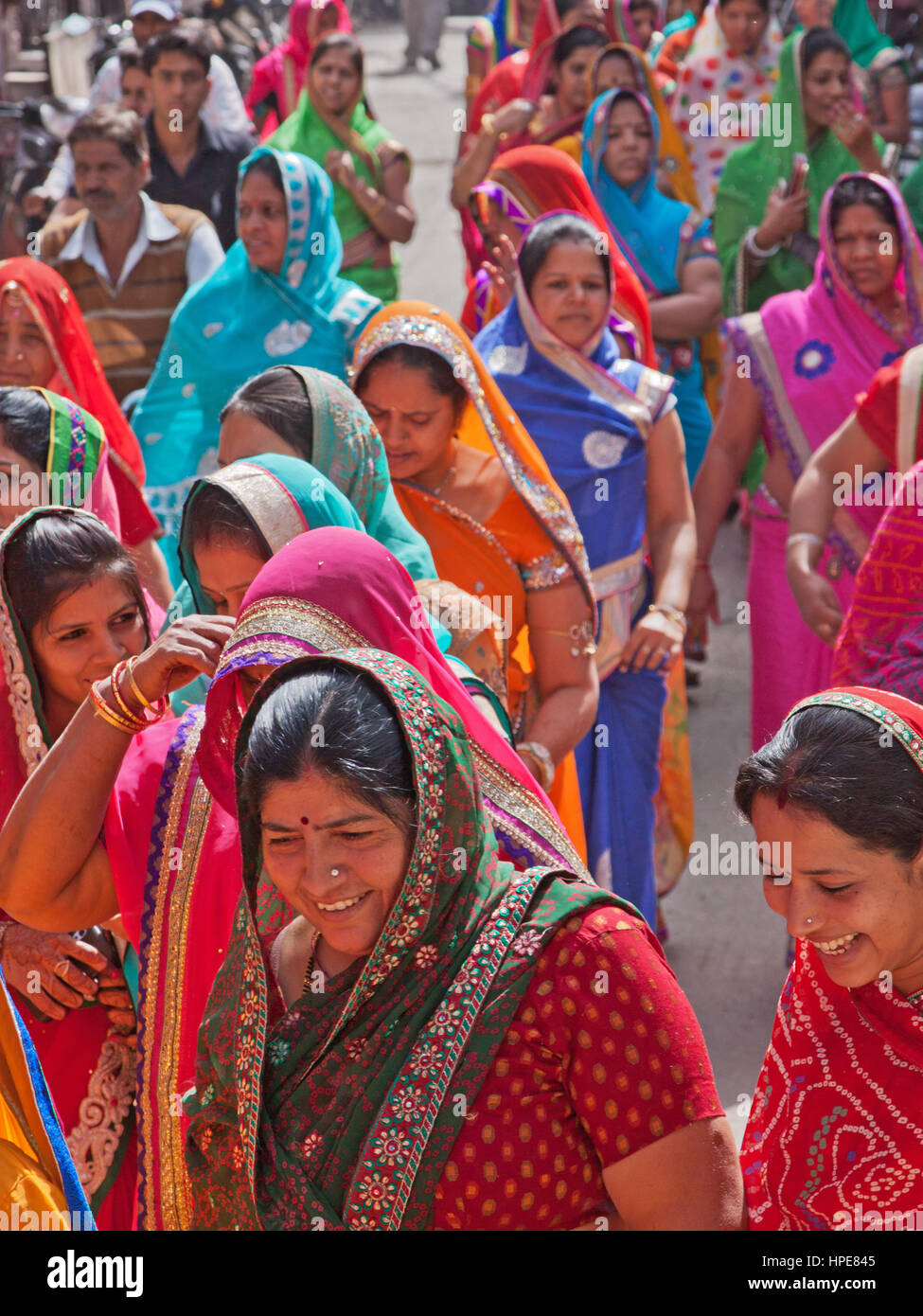 Women in a procession making its way through the streets of Deogarh in ...
