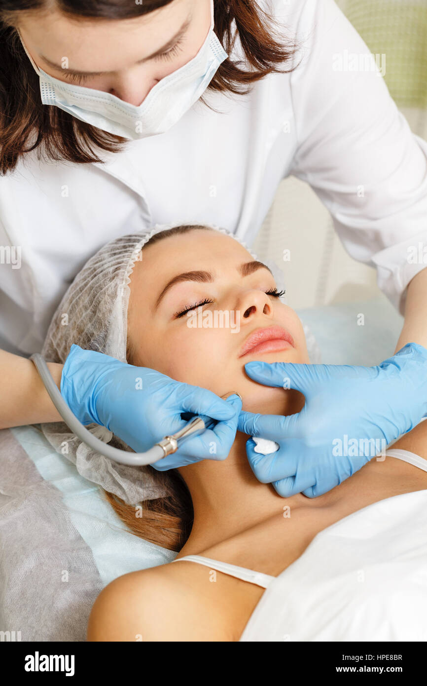 Dermabrasion cheekbones girl. Hardware cosmetology. Spa. Facial ...