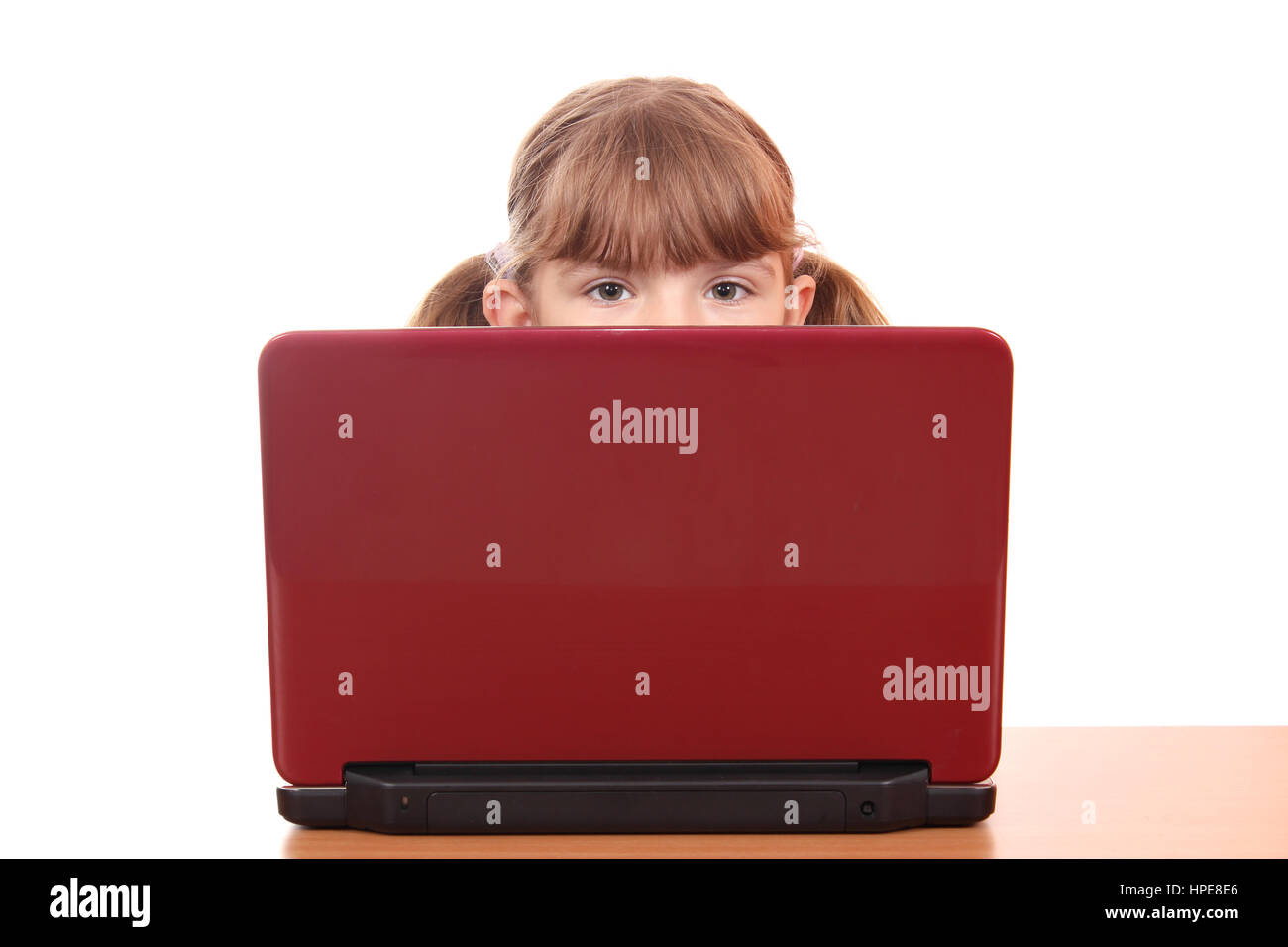 Child behind laptop hi-res stock photography and images - Alamy
