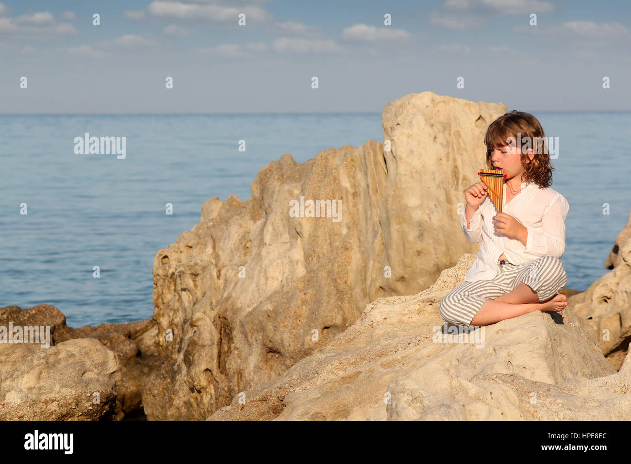 Playing instrument seaside hi-res stock photography and images - Alamy