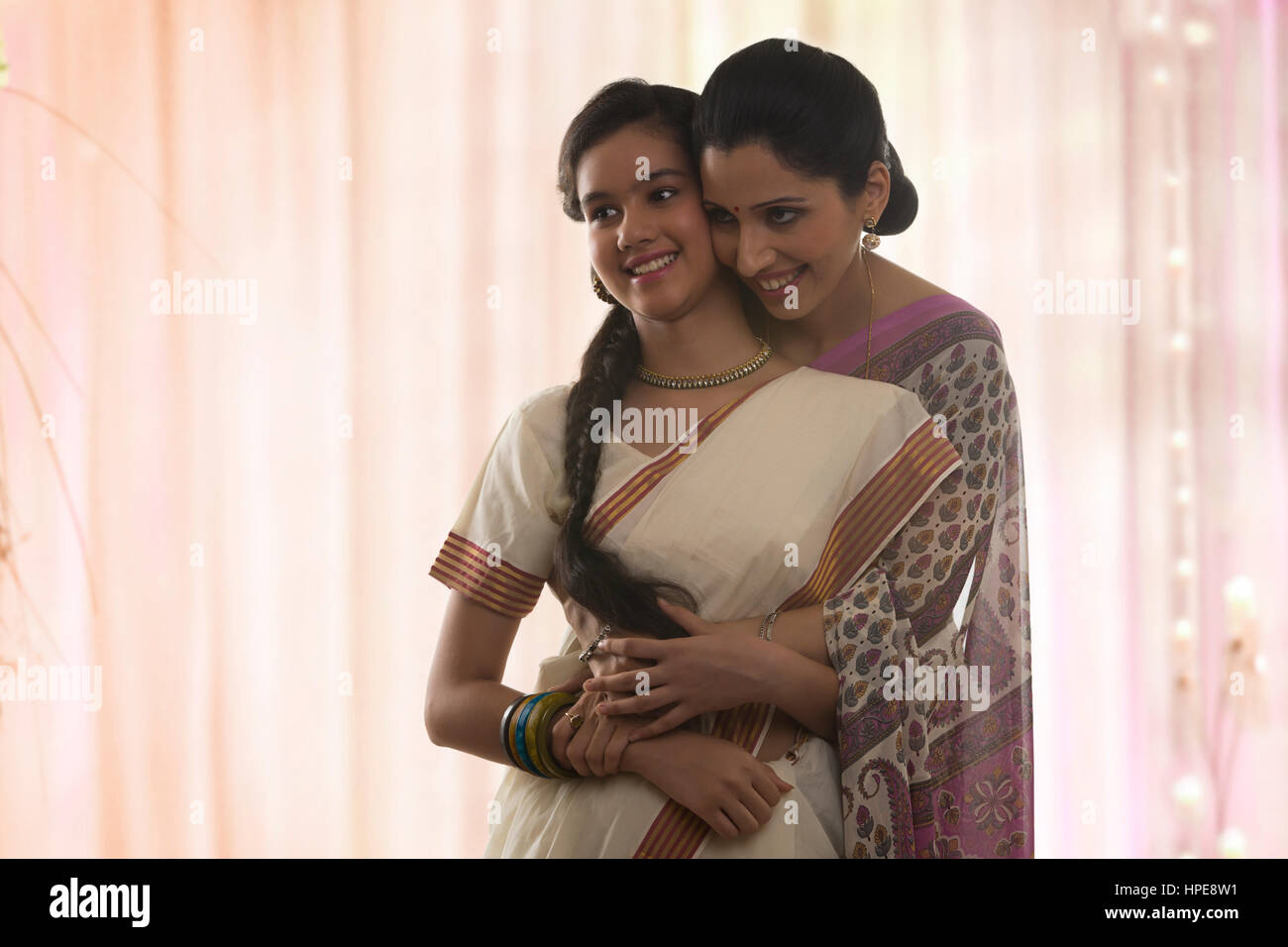 Indian mother and daughter hugging hi-res stock photography and images - Alamy