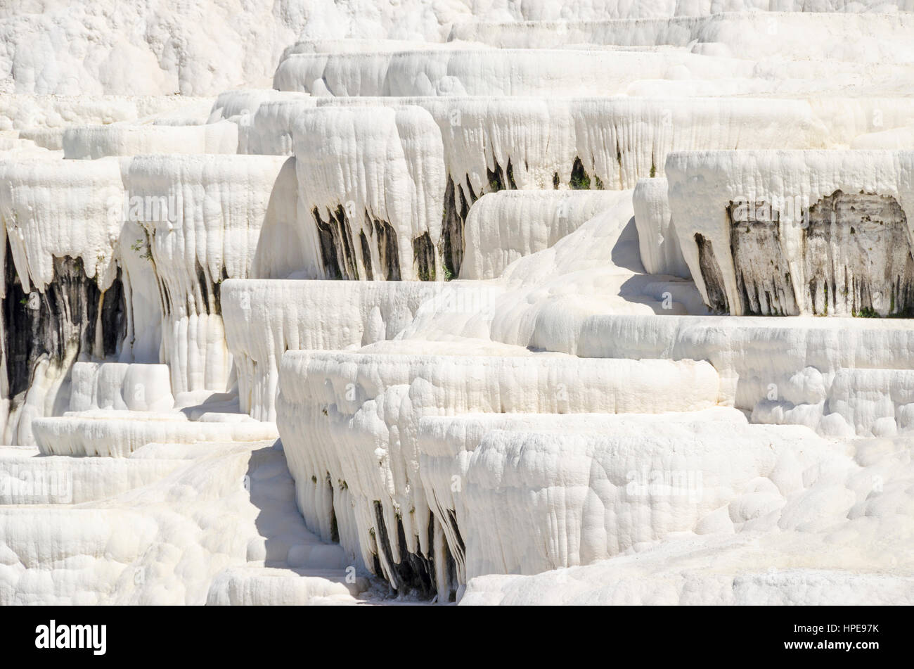 Stalactites of Pamukkale's terraces, made of travertine, a sedimentary ...