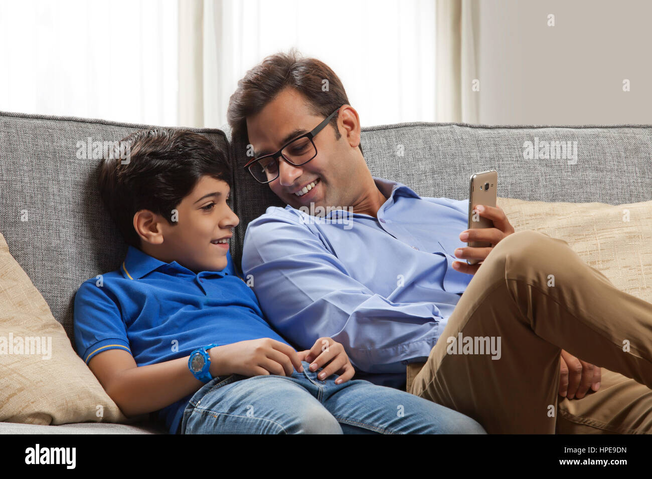 Father son mobile phone hi-res stock photography and images - Alamy