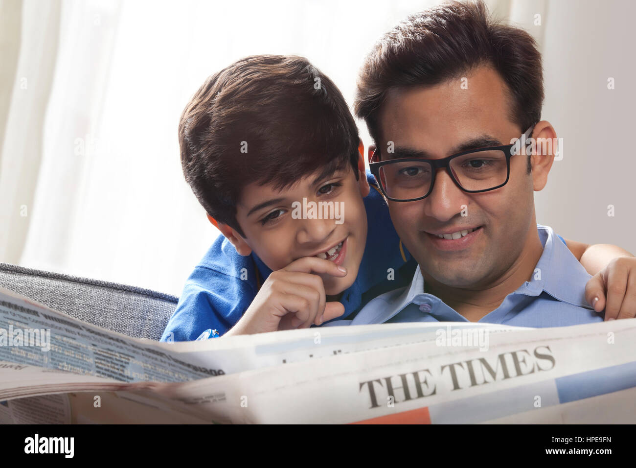 Child reading newspaper hi-res stock photography and images - Alamy