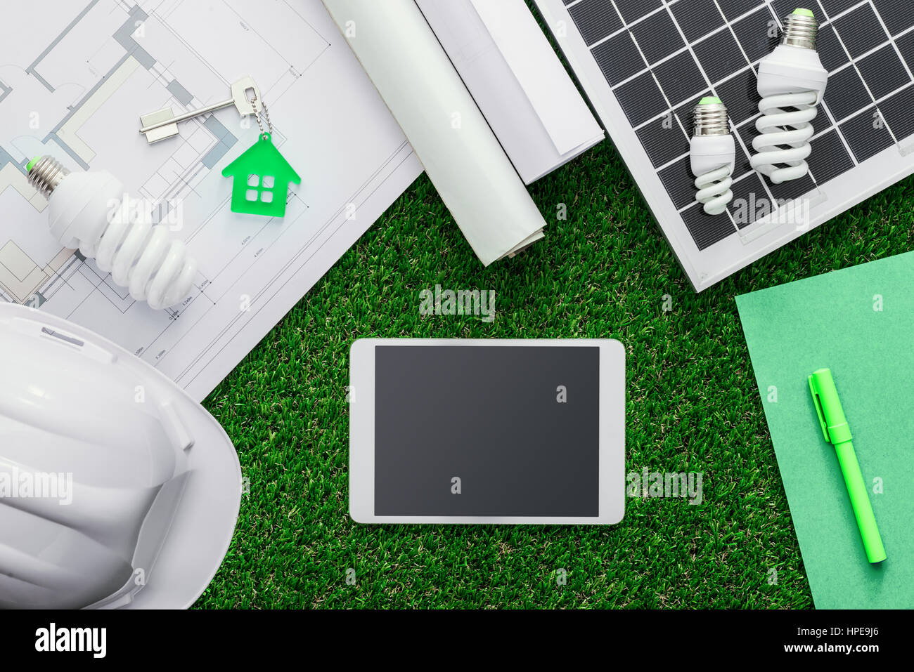 Eco house and sustainable building concept: work tools, solar panel and ...