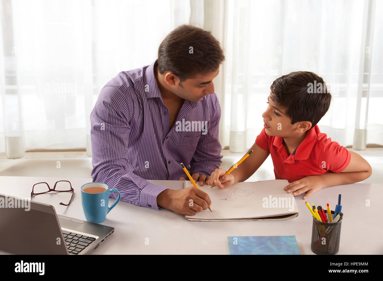 Father sitting desk hi-res stock photography and images - Alamy