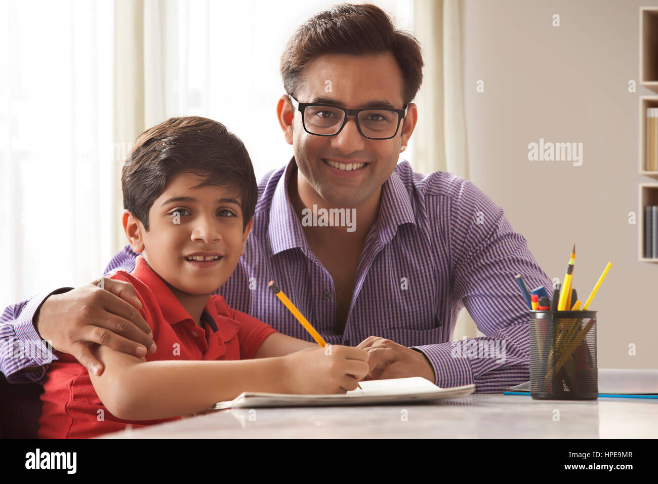Father son desk hi-res stock photography and images - Alamy