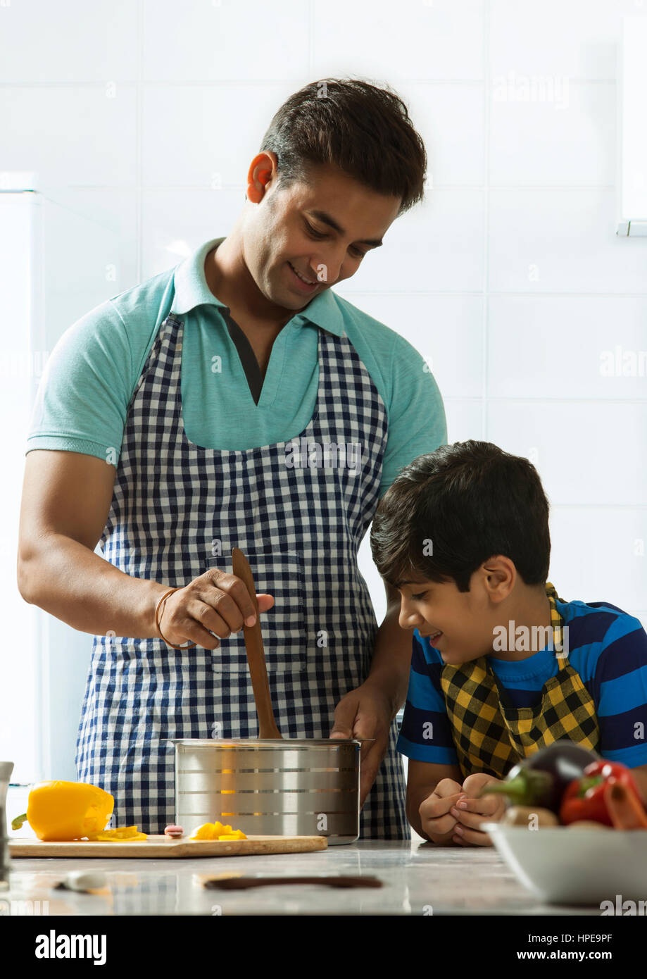 Father and son cooking in kitchen Stock Photo - Alamy