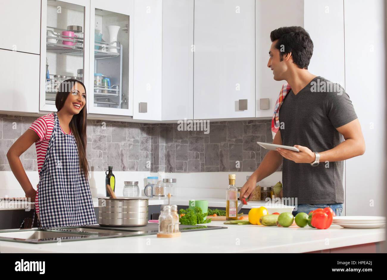 Indian couple cooking hi-res stock photography and images - Alamy