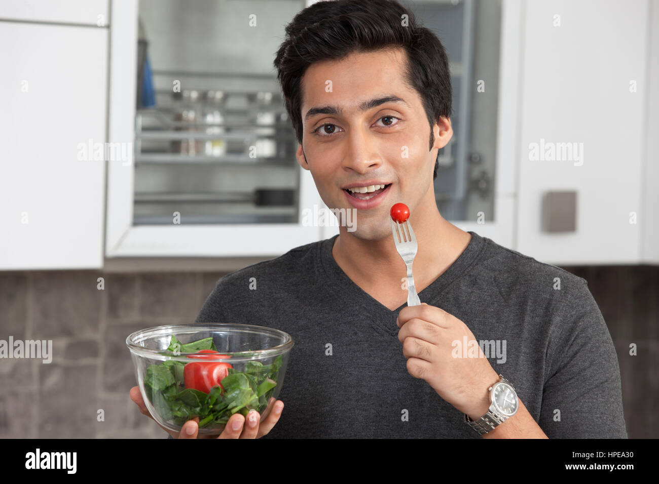 Indian man eating hi-res stock photography and images - Alamy