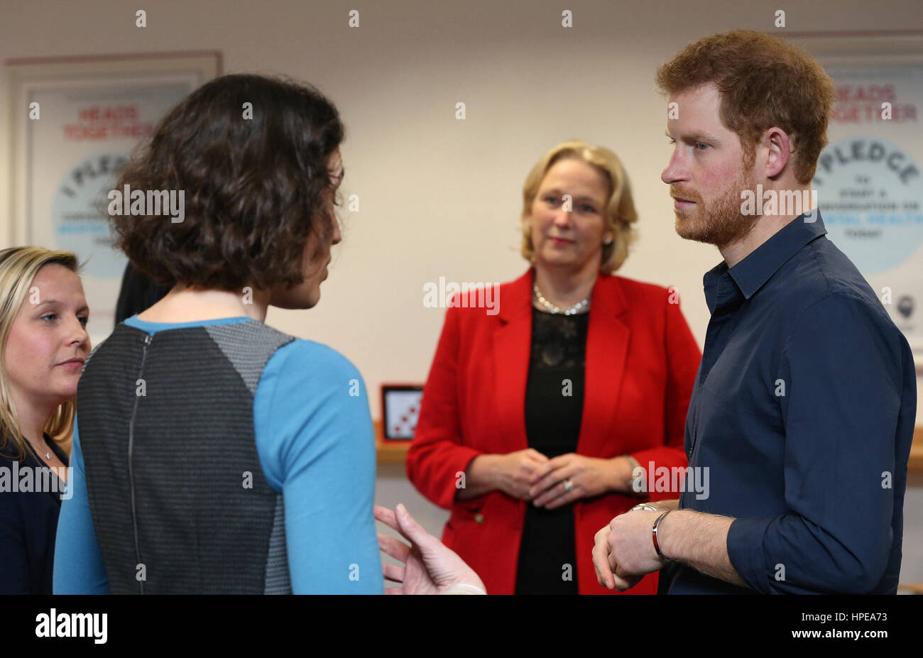 Prince Harry speaks with (left to right) Helena Wood, Pip Langley and ...