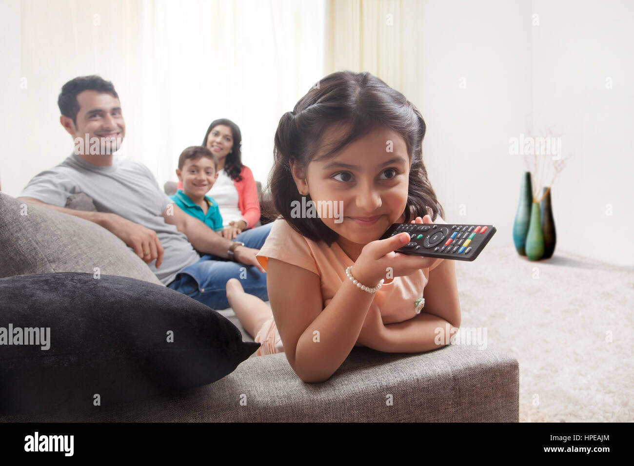 Girls watching tv laughing hi-res stock photography and images - Alamy