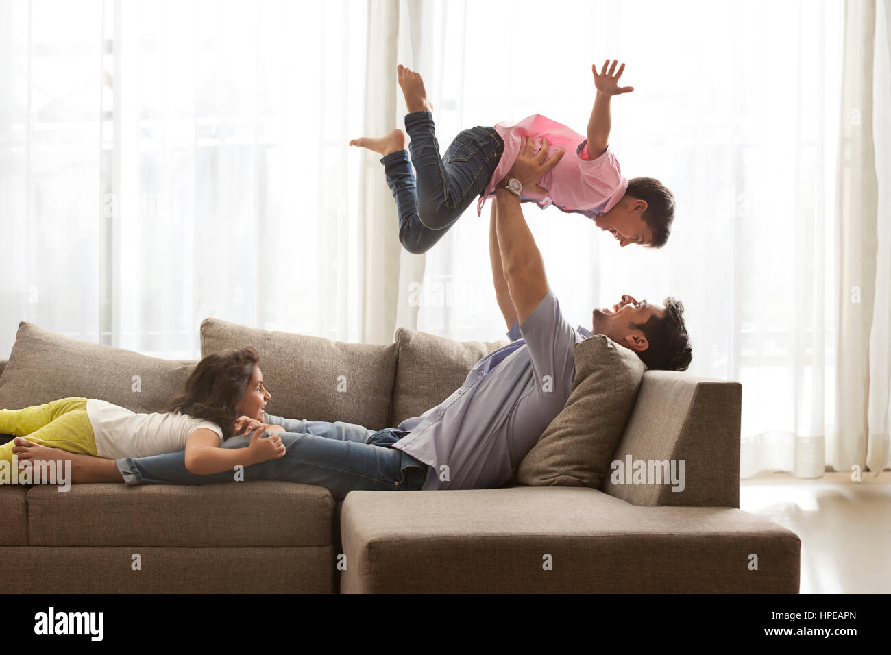 Children playing with father hi-res stock photography and images - Alamy