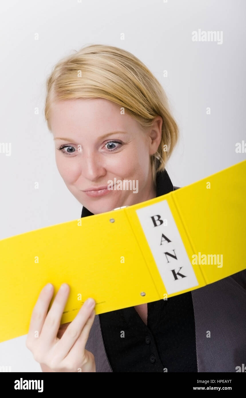 Model released , Junge Frau mit Bankbelegen - young woman with bank ...