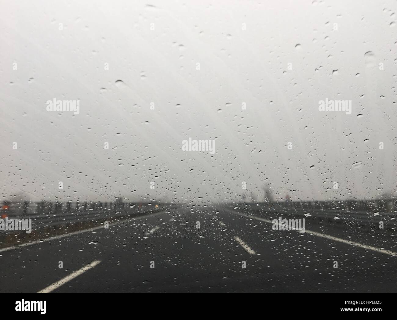to travel in highway with rain and fog Stock Photo - Alamy