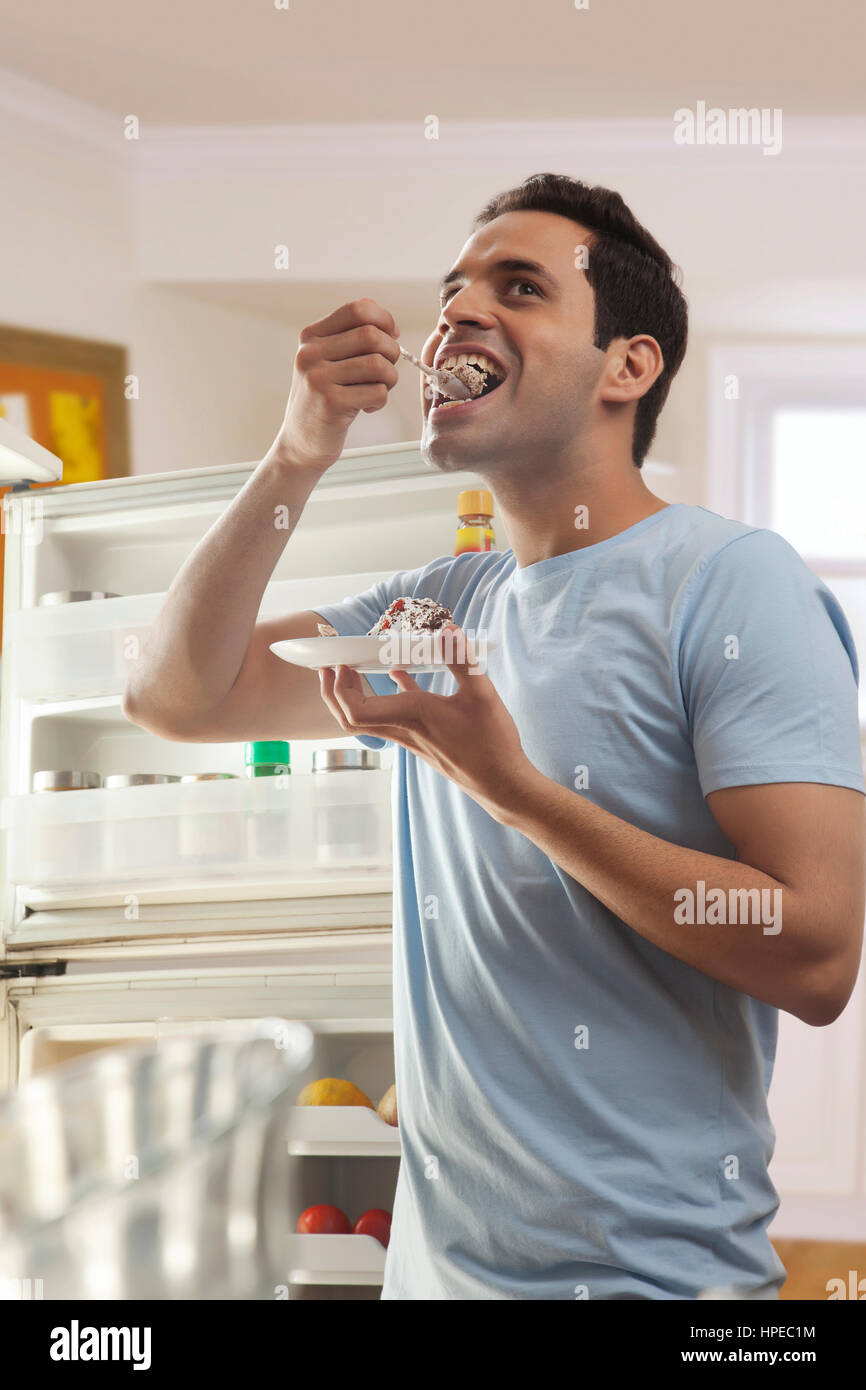 Man standing front fridge hi-res stock photography and images - Alamy