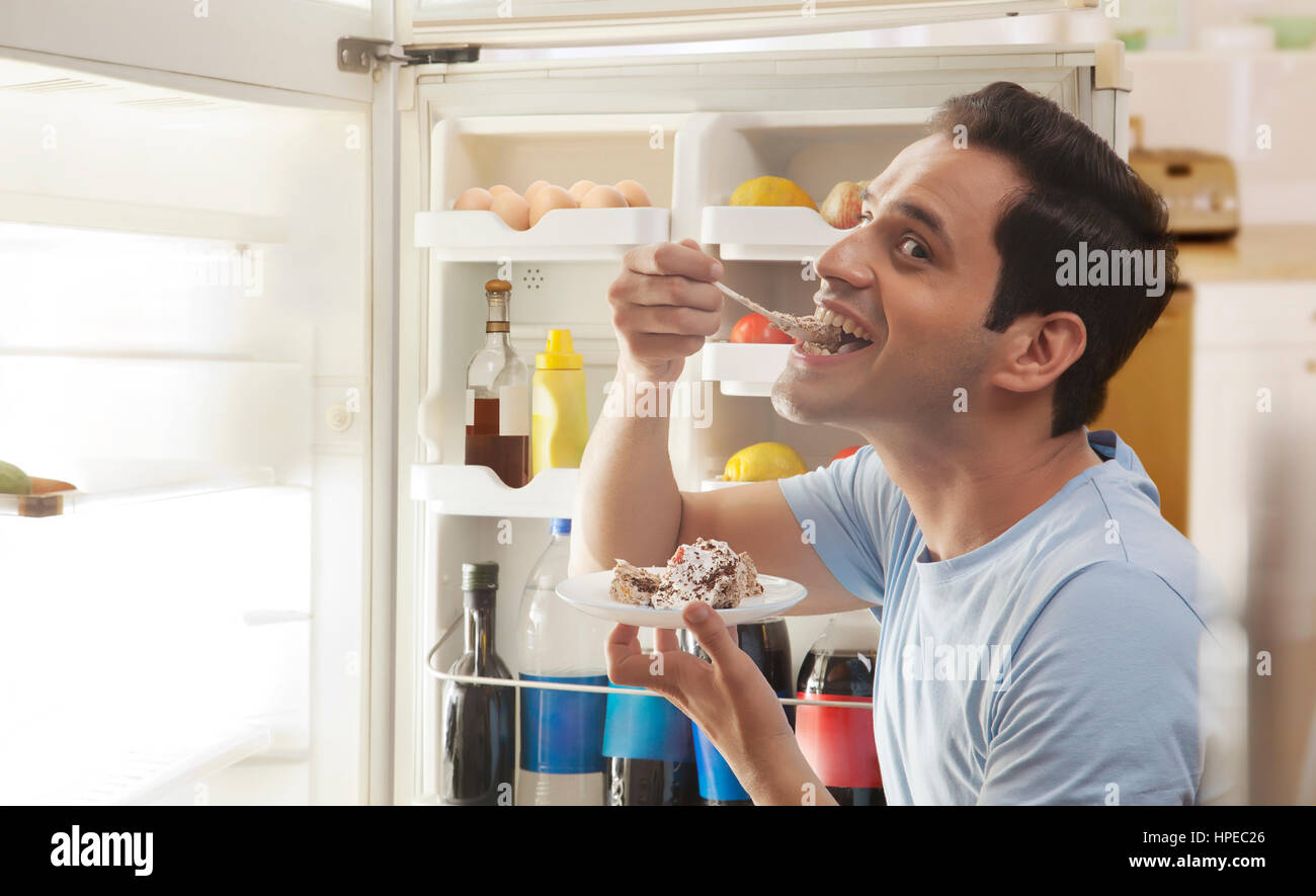 Man standing front fridge hi-res stock photography and images - Alamy