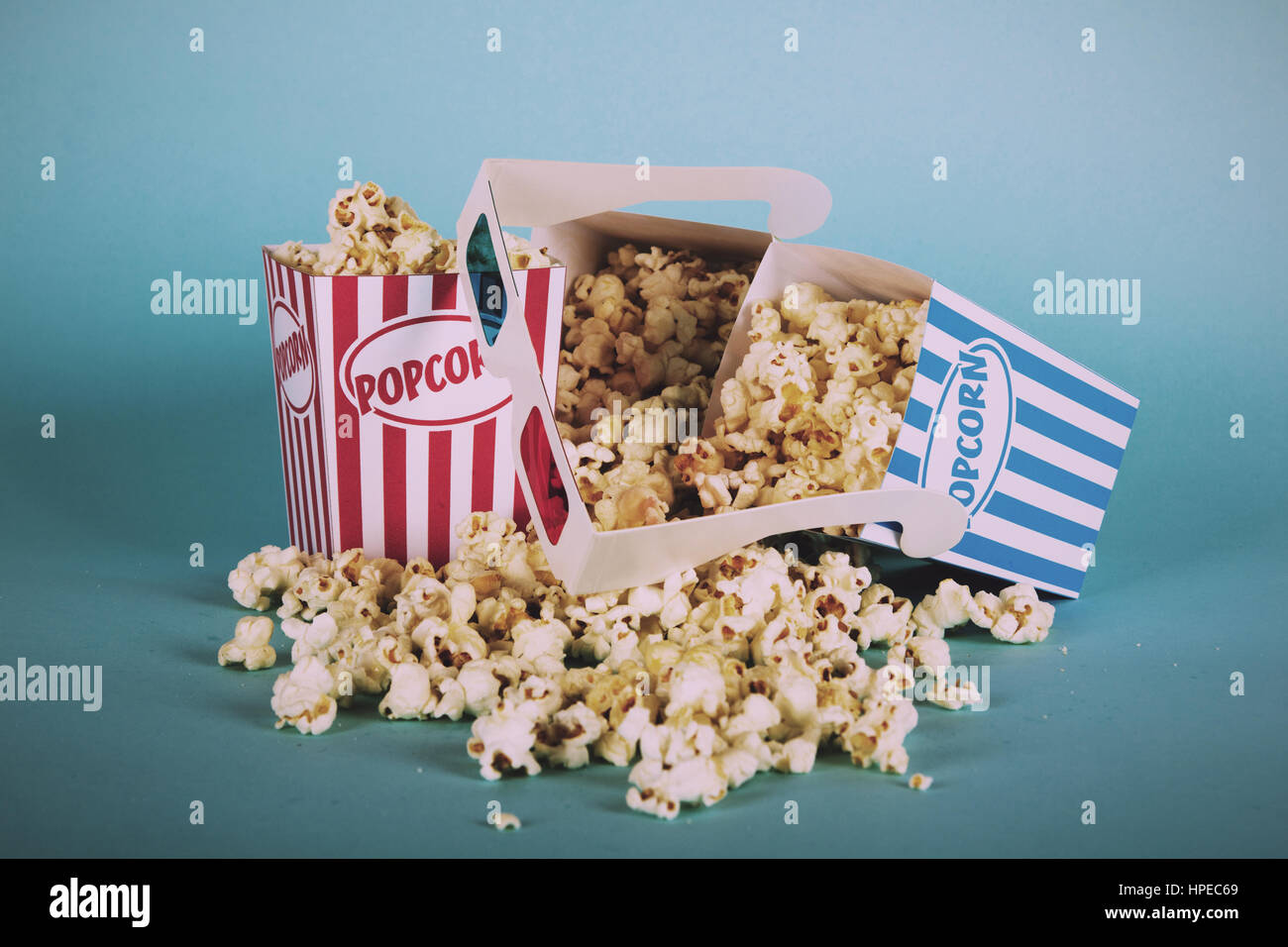 Bucket of popcorn against a blue background Vintage Retro Filter Stock ...