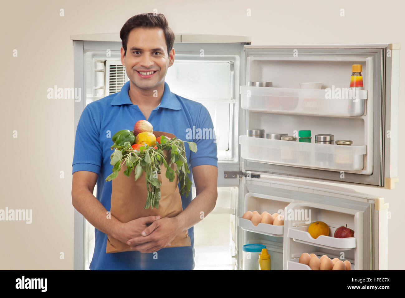 Man Standing Front Fridge High Resolution Stock Photography and Images ...