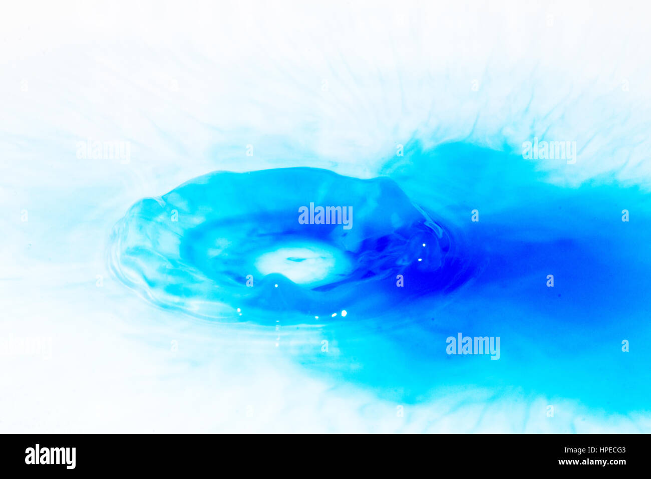 Colorful paint drop splashing on black a background Stock Photo - Alamy