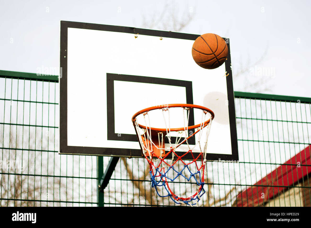 Basketball hoop outside in a school play area Stock Photo - Alamy