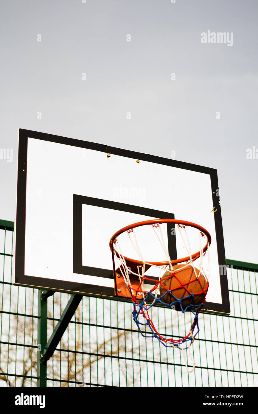 Basketball hoop outside in a school play area Stock Photo - Alamy