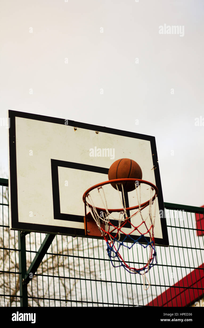 Basketball hoop outside in a school play area Stock Photo - Alamy