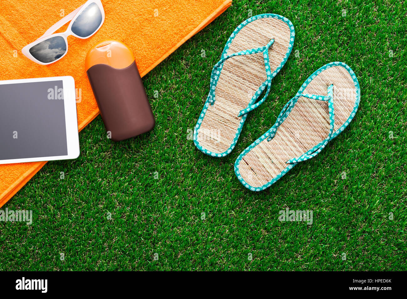 Sunglasses, suntan lotion, flip-flops and digital tablet: summertime ...
