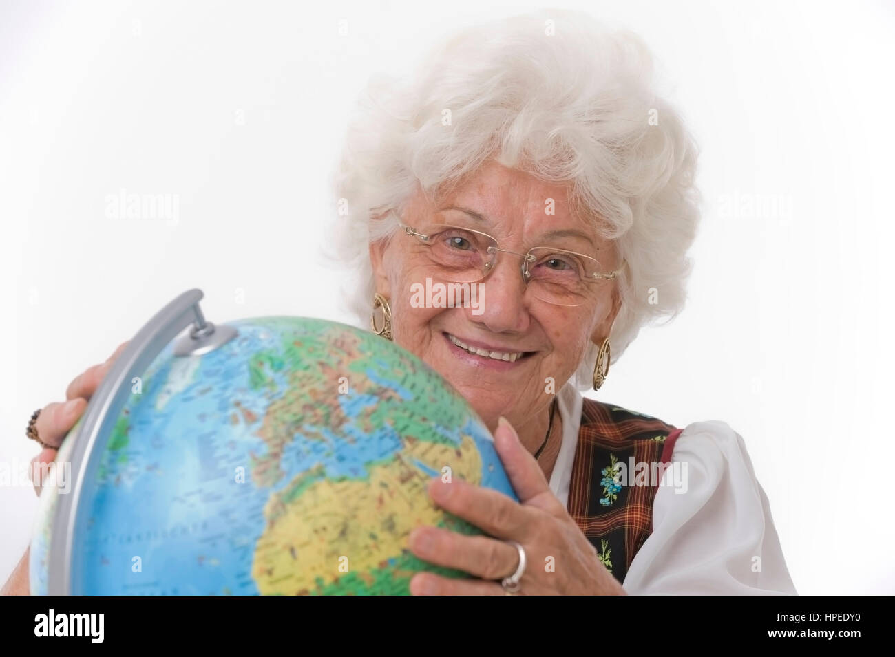 Model released , Seniorin mit Globus - older person with globe Stock ...