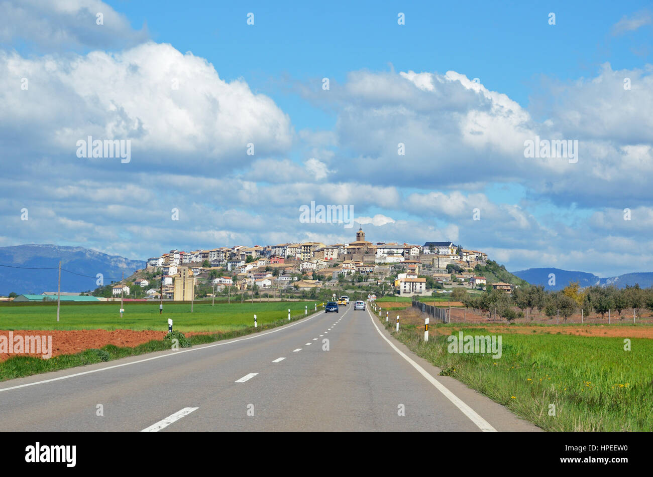 The road leads to the Spanish town Berdun on the hill surrounded with ...