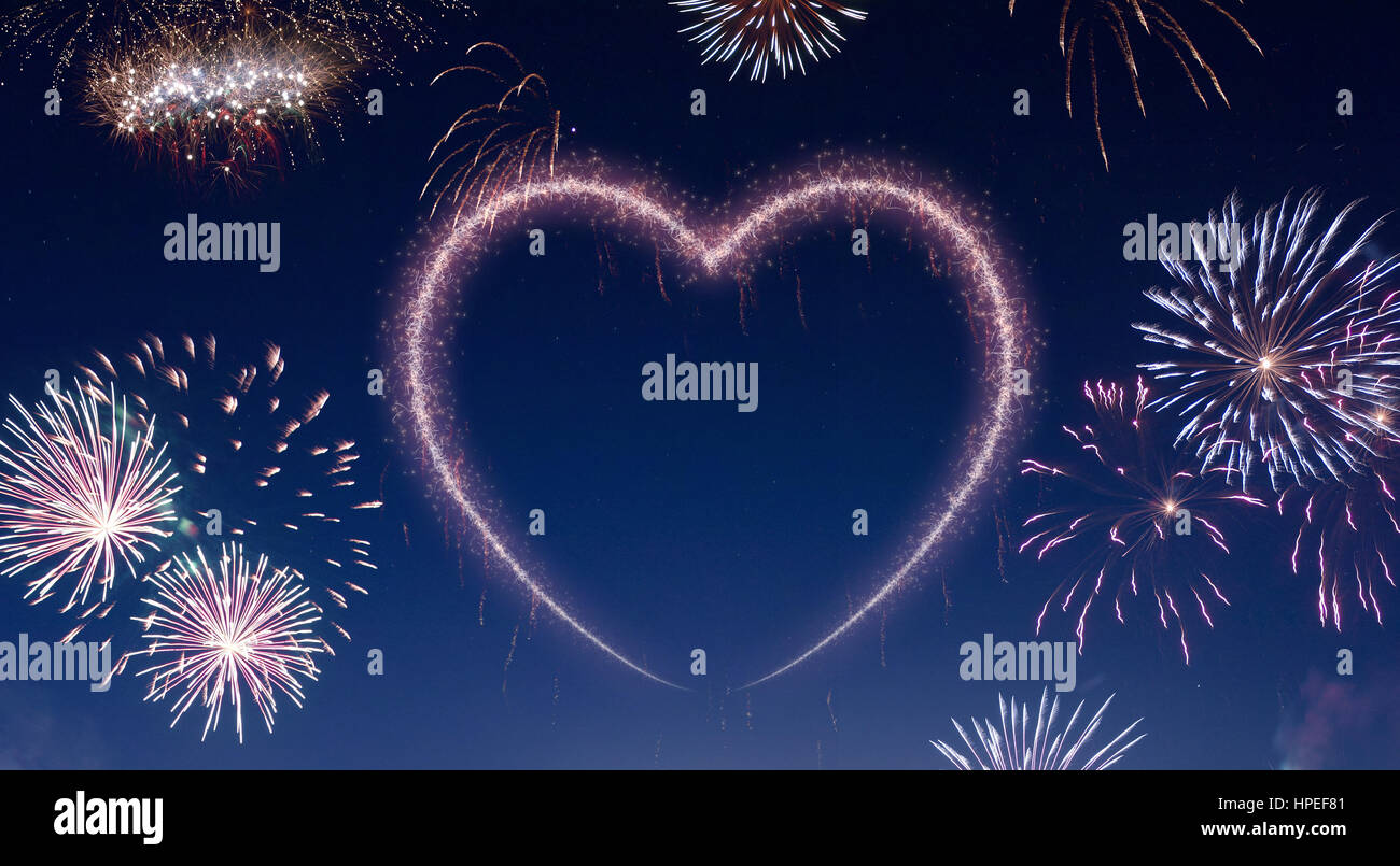 A dark night sky with a sparkling red firecracker in the shape of a ...