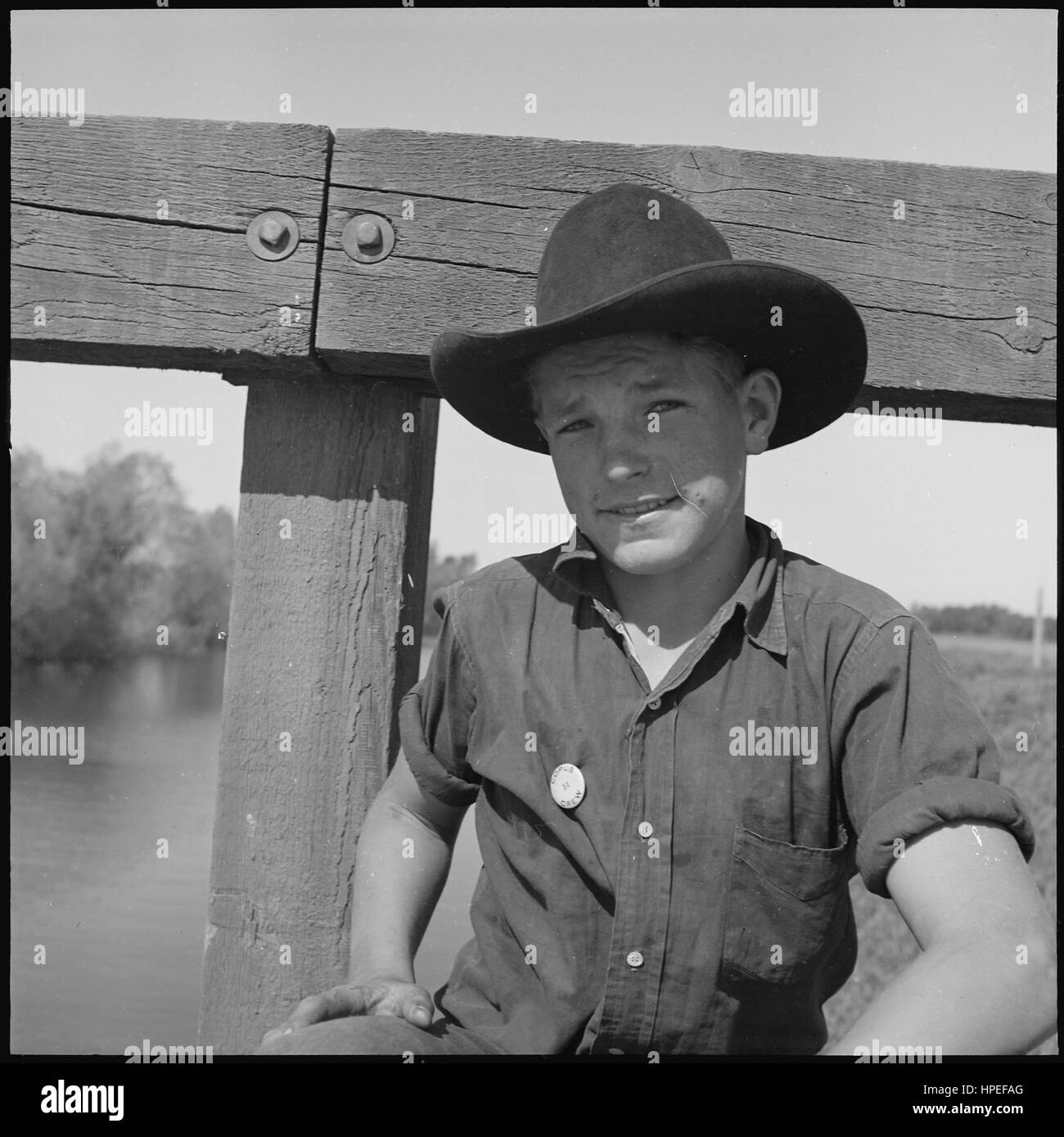 Photographic portrait of a sixteen year old laborer wearing a labor ...