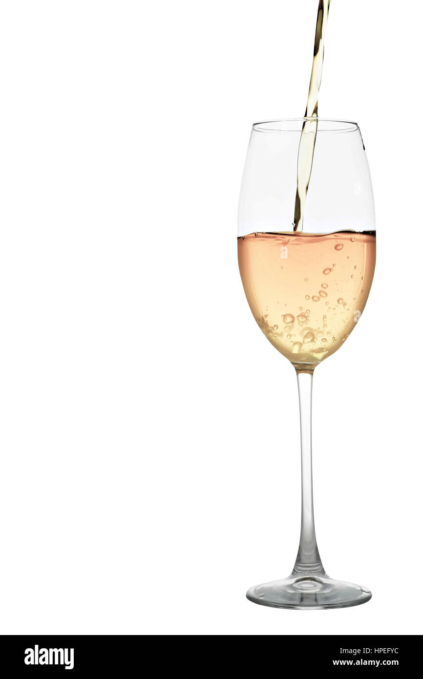 White wine flowing into a glass isolated on white background Stock ...