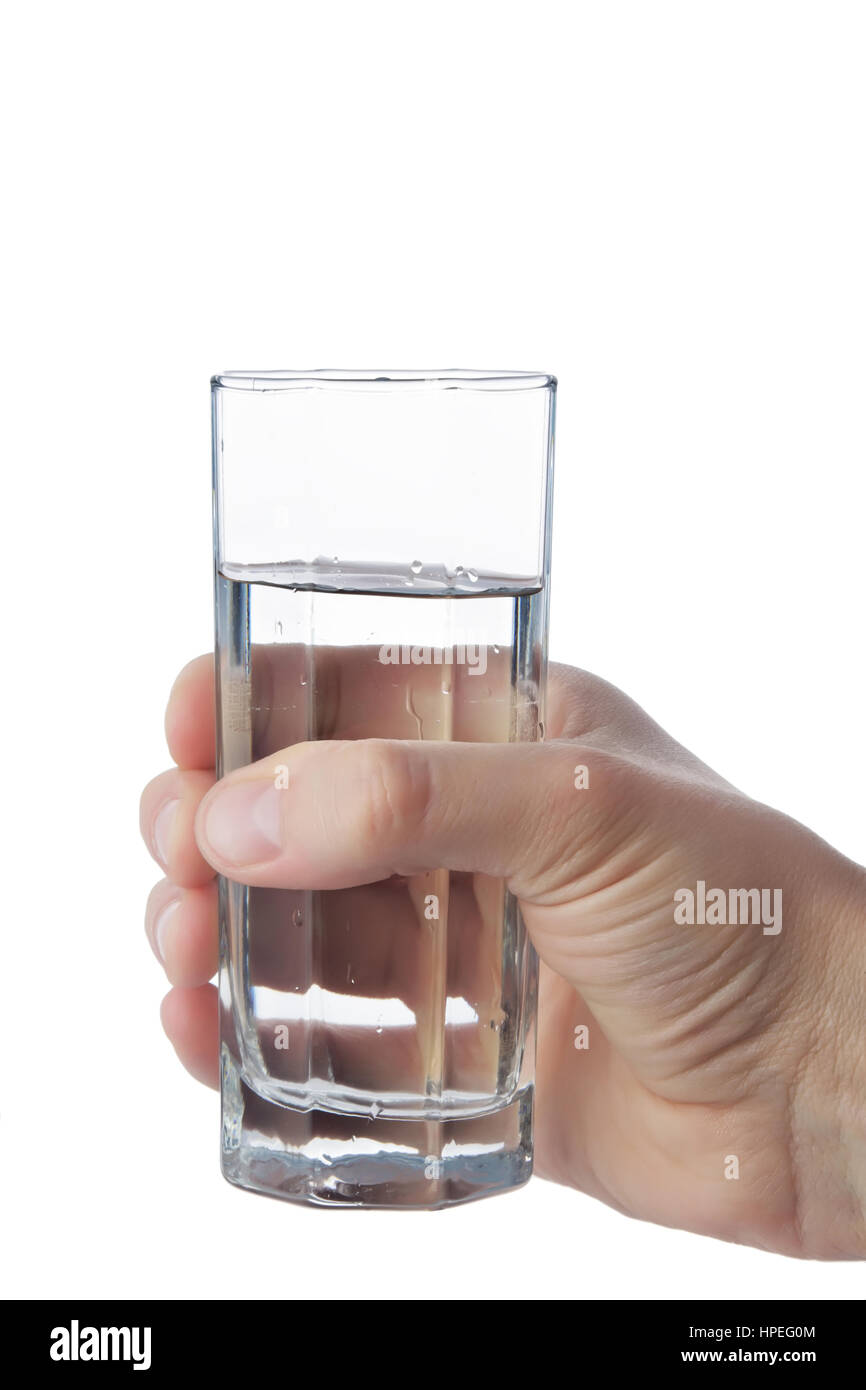 Man's hand holding glass of natural water isolated on white background ...